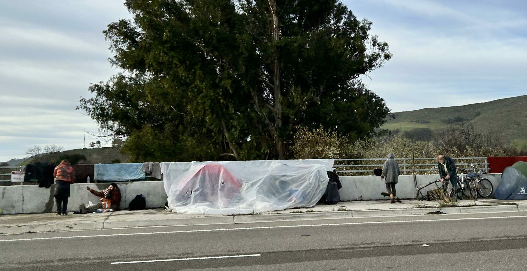 Homeless move to SLO overpass as storm approaches